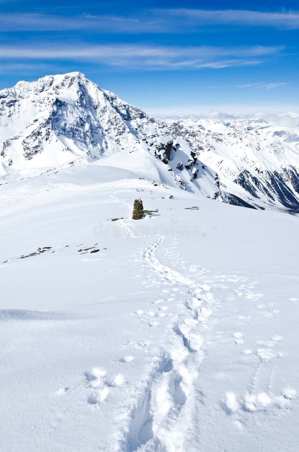 Tracks in the Snow on the Peak of a Mountain Stock Photo - Image of ...
