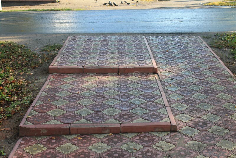 Tracks from tiles stock photo. Image of alleys, design - 76410438