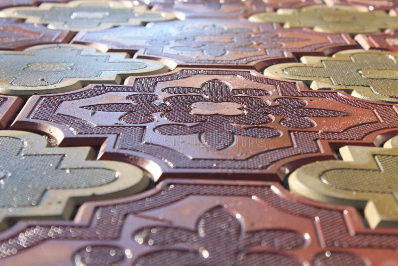 Tracks from tiles stock image. Image of alleys, tile - 76410541