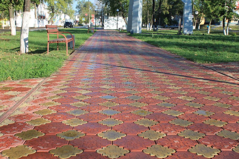 Tracks from tiles stock photo. Image of alley, city, tiles - 76410570