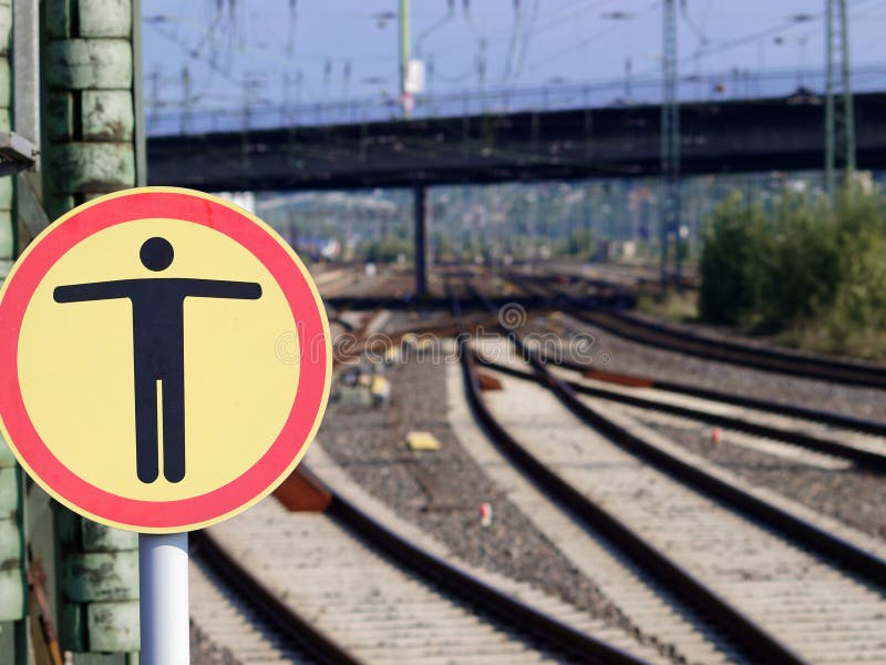 Tracks at the Train Station with a Warning Sign. Stock Image - Image of ...