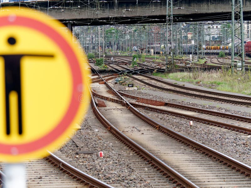Tracks at the Train Station with a Warning Sign. Stock Photo - Image of ...