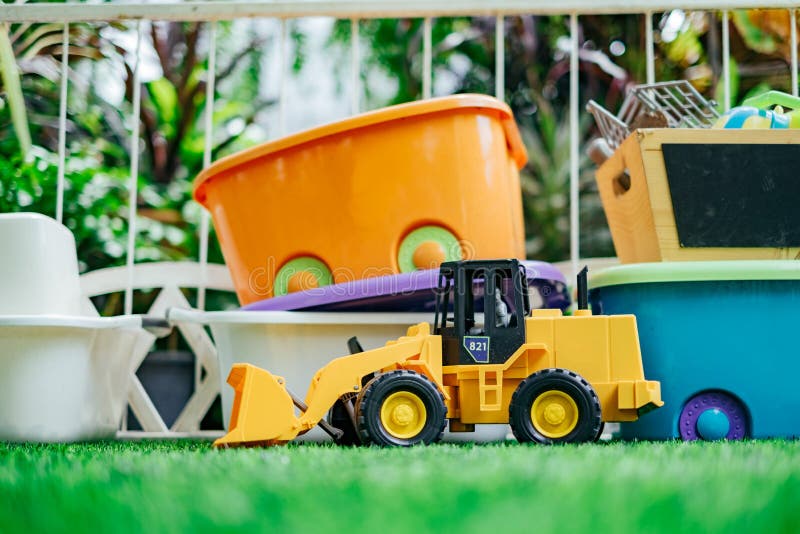 Tracktor Toy Car with Toy Boxes in the Garden Stock Photo - Image of ...