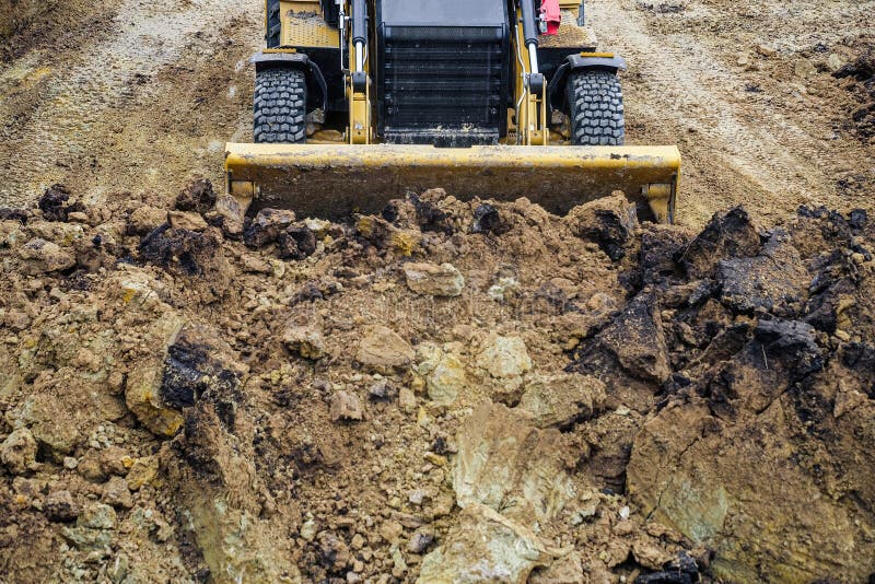 Backhoe Loader Moves Clay Soil in the Excavation To the Dump Stock ...