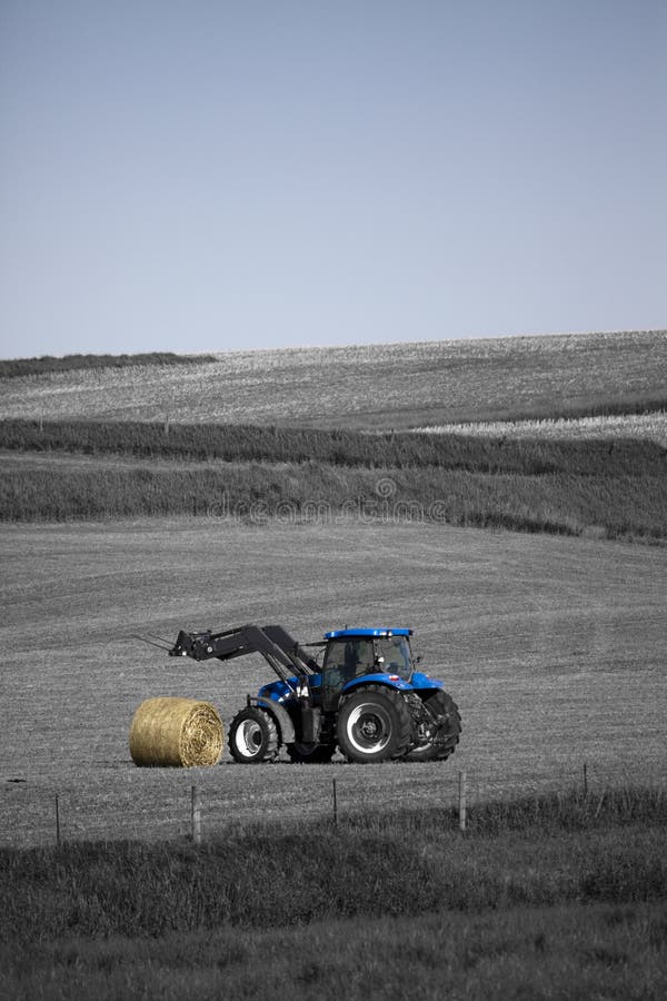 Tractor with Bail of Hay stock photo. Image of fields - 14497664