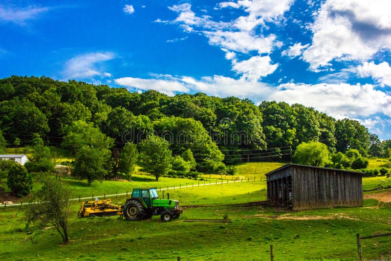 Tractor and Barn Farm Landscape Stock Photo - Image of clouds ...