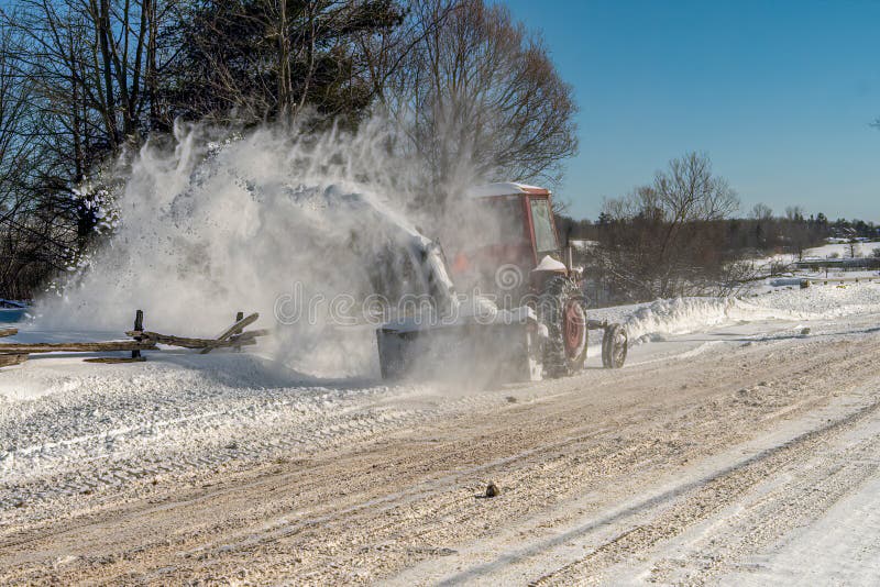Tractor blowing snow stock image. Image of track, tree - 266713947