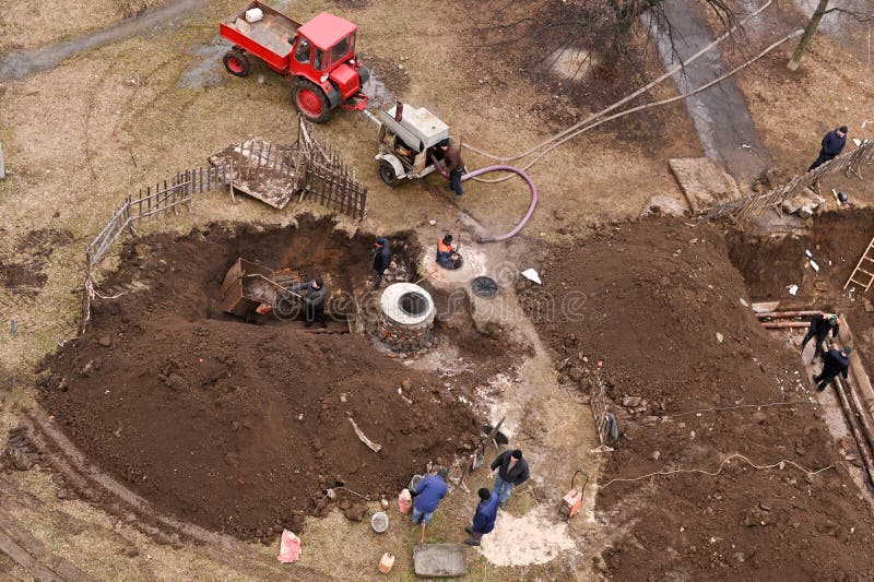 The Tractor Brought a Compressor for Pumping Water Out of the Sewer ...