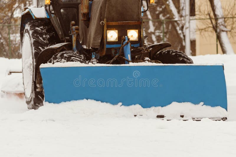 A Tractor with Brushes Removes Snow on the Rink Stock Photo - Image of ...