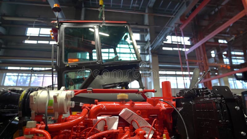 The Tractor Cab is Suspended in the Workshop on a Crane Beam, the ...