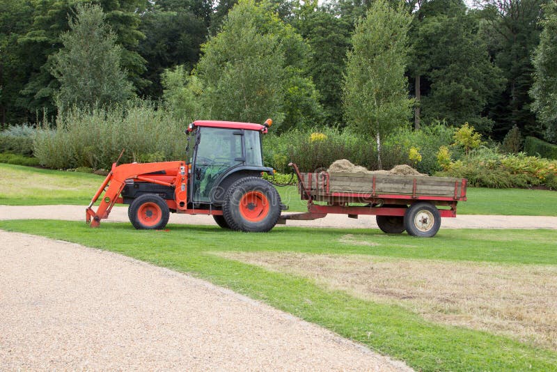 Tractor and Cart with Hay in Garden Stock Image - Image of machine ...