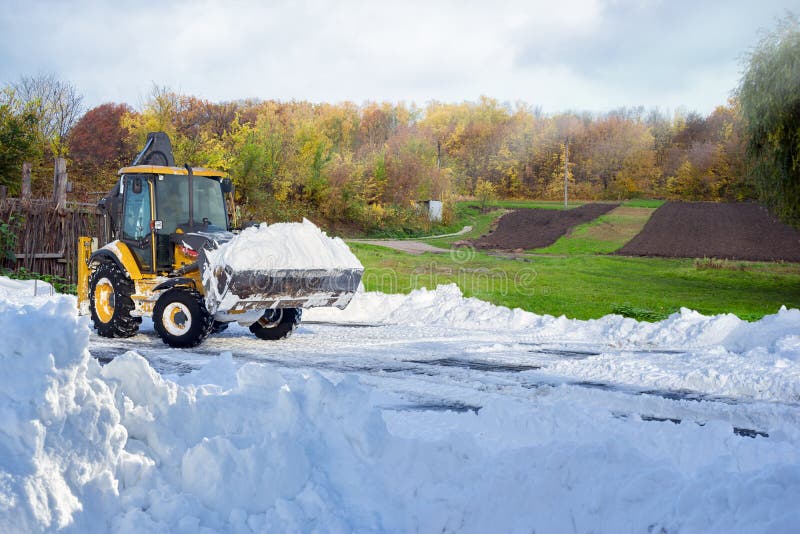 Tractor Cleaning Snow in Field Stock Photo - Image of roadway, tractor ...