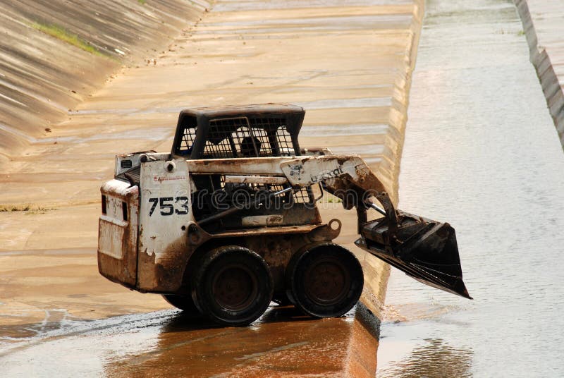 Tractor cleaning th stock image. Image of outdoor, flow - 2579241