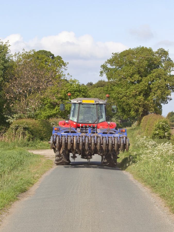 Tractor on a country road stock photo. Image of countryside - 19506794