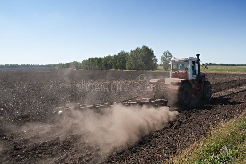 Tractor Cultivating a Field Stock Image - Image of worker, iron: 21533229