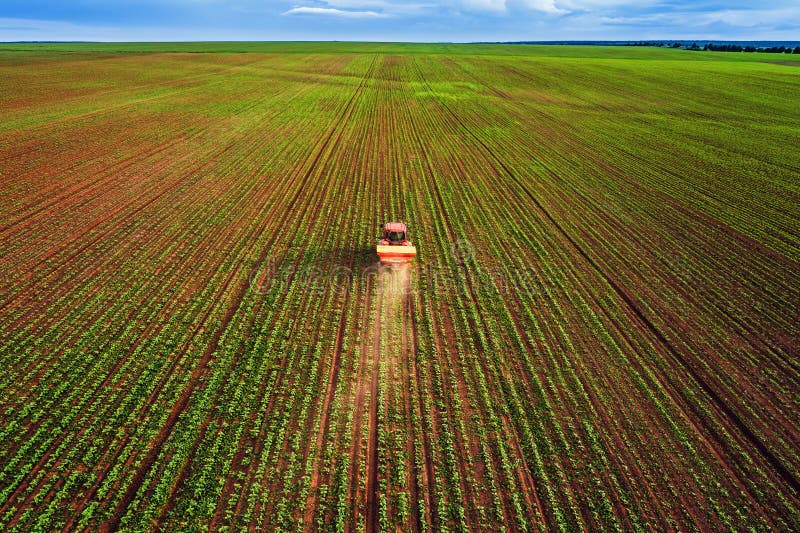 Tractor Cultivating Field at Spring, Aerial View. Stock Image - Image ...