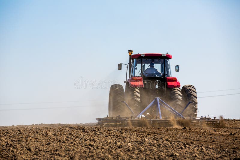 Tractor Cultivating Field at Spring Stock Photo - Image of cultivation ...