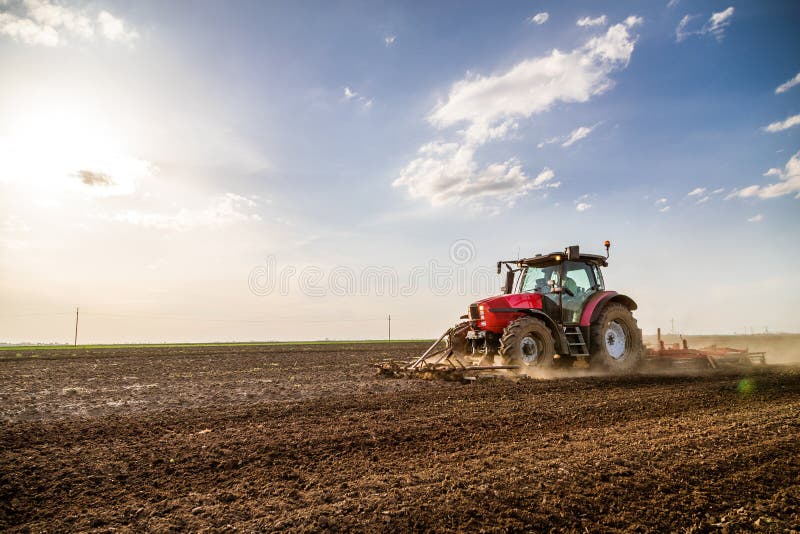 Tractor Cultivating Field at Spring Stock Image - Image of industry ...