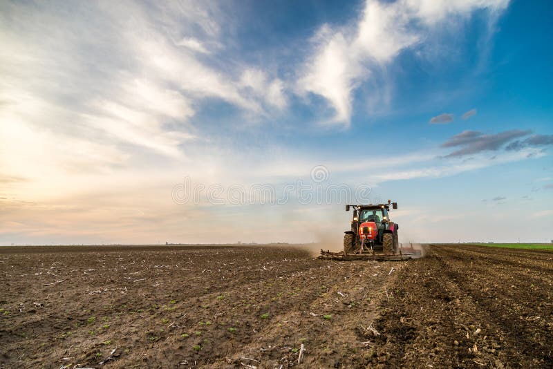 Tractor Cultivating Field at Spring Stock Image - Image of machine ...