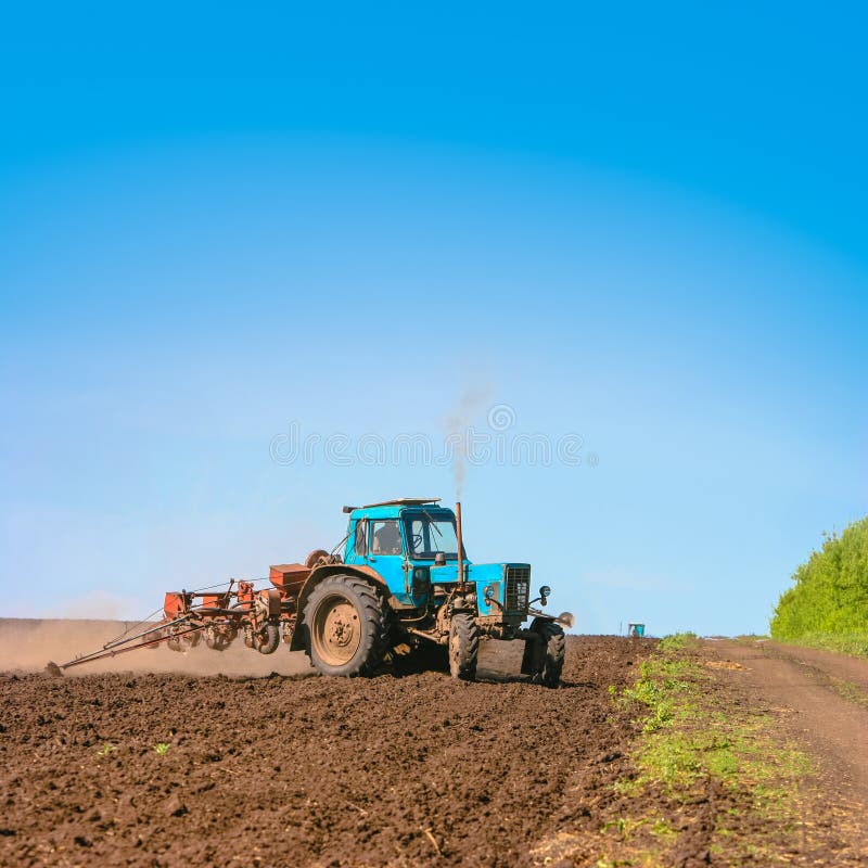 Tractor Cultivating Field at Spring Stock Photo - Image of farm ...