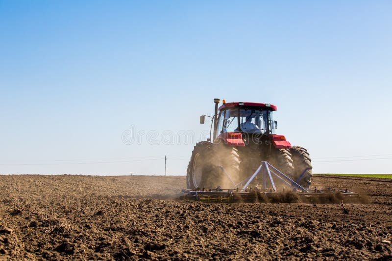 Tractor Cultivating Field at Spring Stock Image - Image of farm, field ...