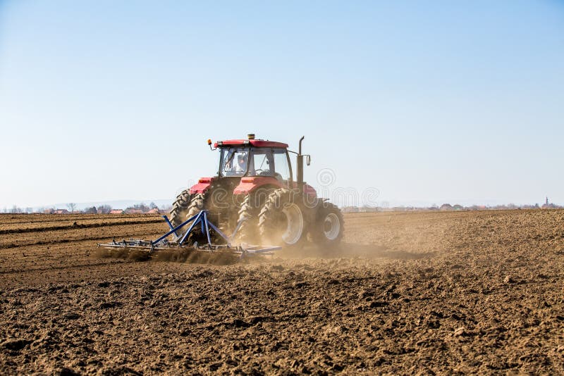 Tractor Cultivating Field at Spring Stock Image - Image of plough ...