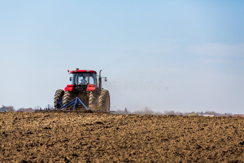 Tractor Cultivating Field at Spring Stock Image - Image of harrow ...