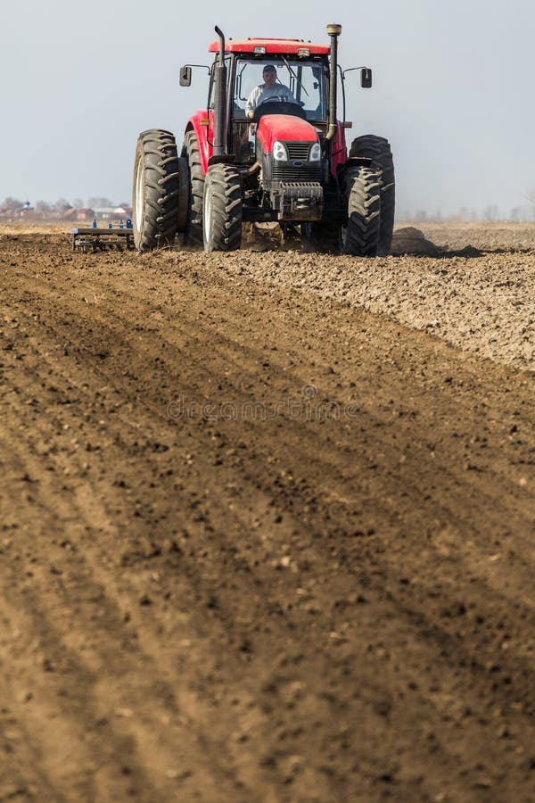Tractor Cultivating Field at Spring Stock Photo - Image of agricultural ...