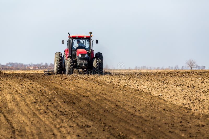 Tractor Cultivating Field at Spring Stock Image - Image of farm, land ...