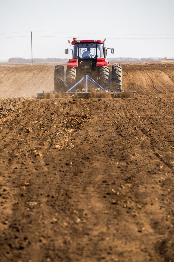 Tractor Cultivating Field at Spring Stock Image - Image of agriculture ...