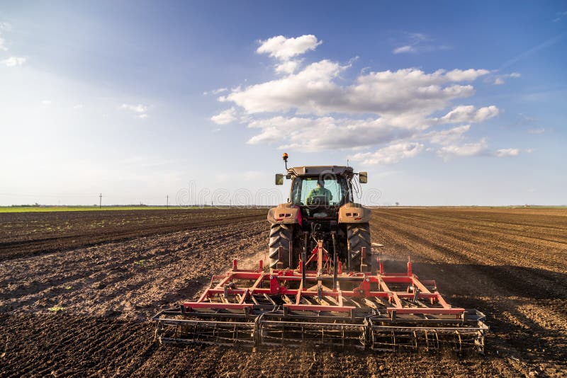 Tractor Cultivating Field at Spring Stock Photo - Image of industry ...