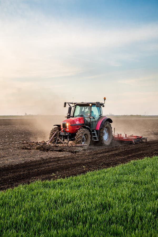 Tractor Cultivating Field at Spring Stock Image - Image of cultivate ...