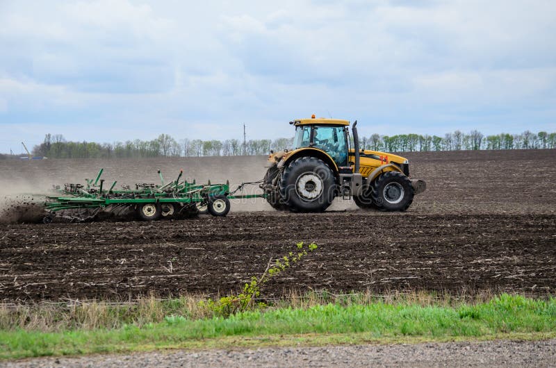 Green Tractor In Field Cultivating Soil Editorial Stock Photo - Image ...