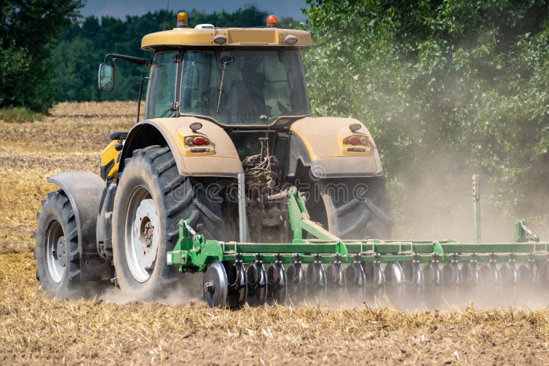 Tractor Cultivating the Field Stock Image - Image of farming, plow ...