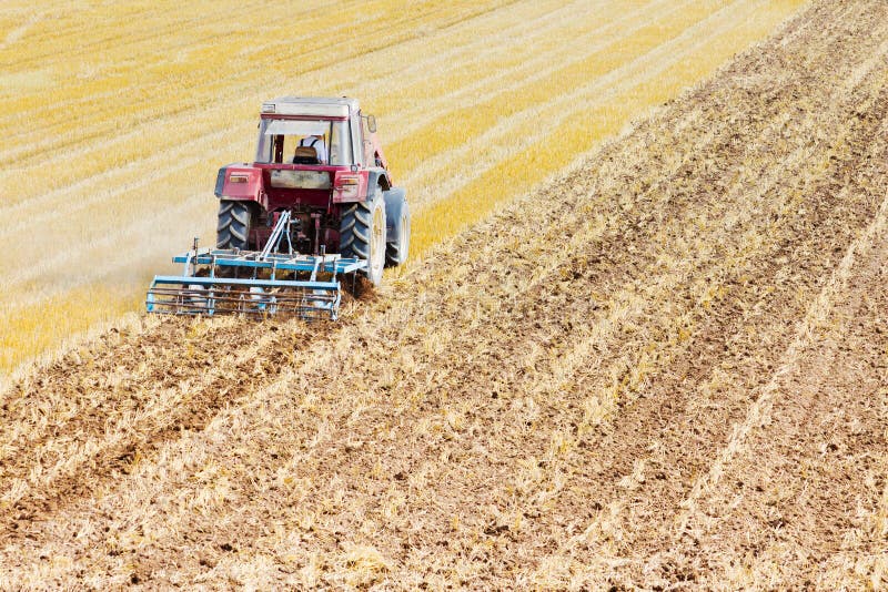 Tractor with cultivator stock photo. Image of harvest - 26273470