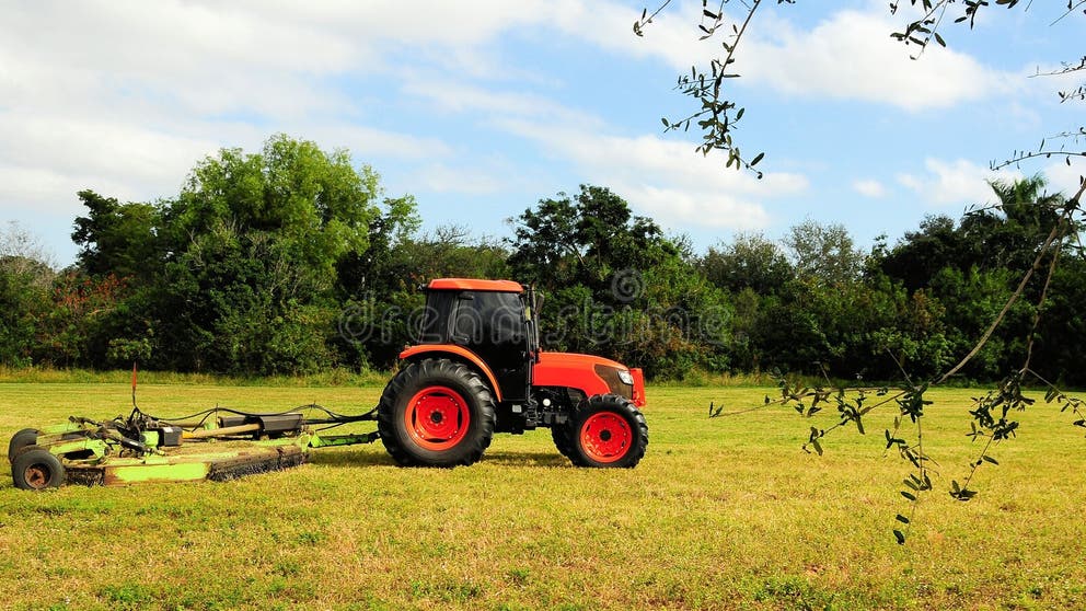 Tractor cutting grass stock photo. Image of engine, lawn - 34327672