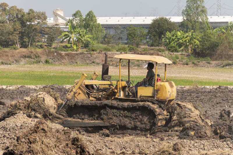 The Tractor is Digging in the Construction Site Stock Photo - Image of ...