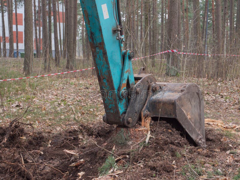 Tractor Digging the Ground with a Bucket, Caterpillar Close-up, Tree ...