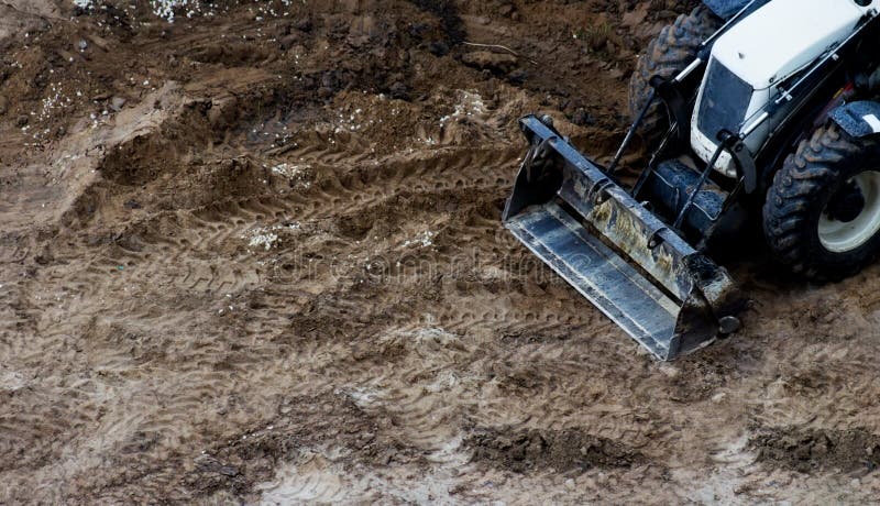 Tractor Digging the Ground with a Bucket, Caterpillar Close-up, Tree ...