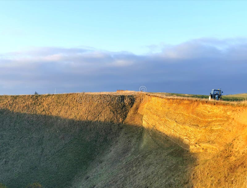 Tractor Driving on Cliff Edge Stock Image - Image of nature, horizon ...