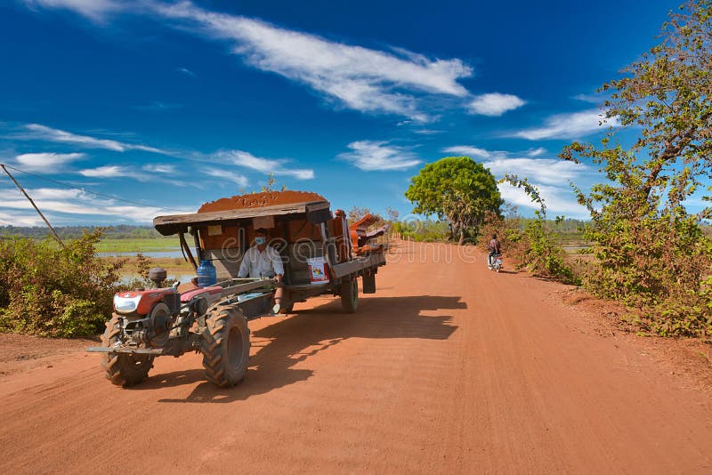 Tractor on an Empty Rural Road on a Sunny Day Editorial Photo - Image ...