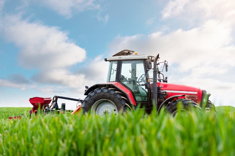 Farmer with His Tractor Planting or Sowing in the Fields Stock Photo ...