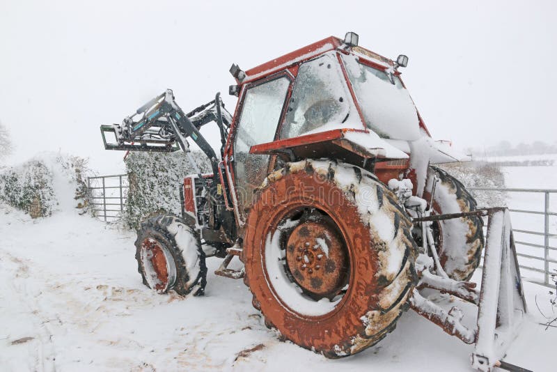 Tractor in the Snow stock image. Image of field, machine - 261724149