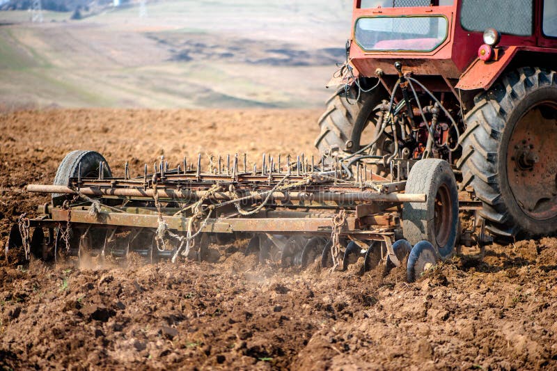 Tractor at Farm Working the Field Stock Photo - Image of landscape ...