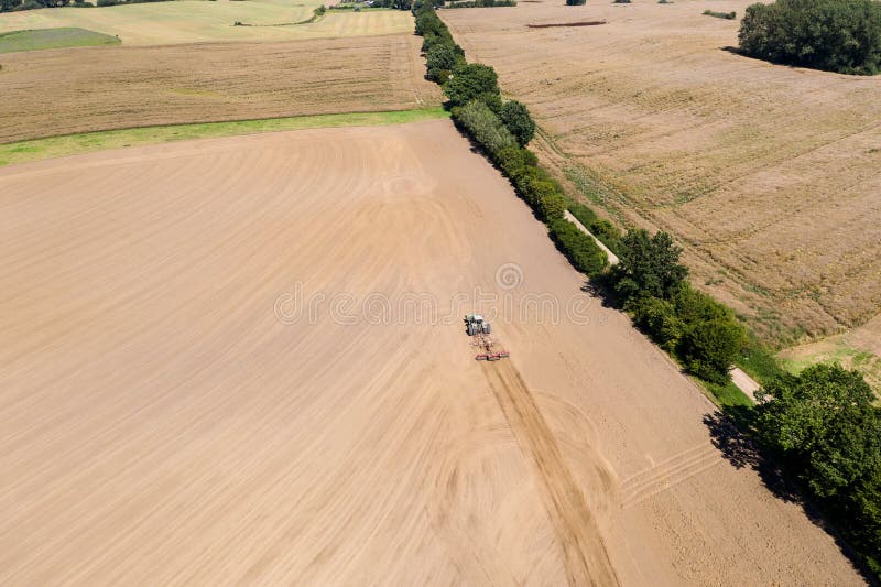Tractor in a Farming Landscape with a Plow from Above Stock Photo ...