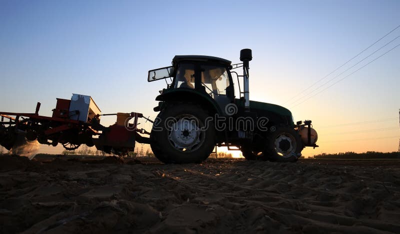 The Tractor in Farmland Farming Stock Photo - Image of crop ...