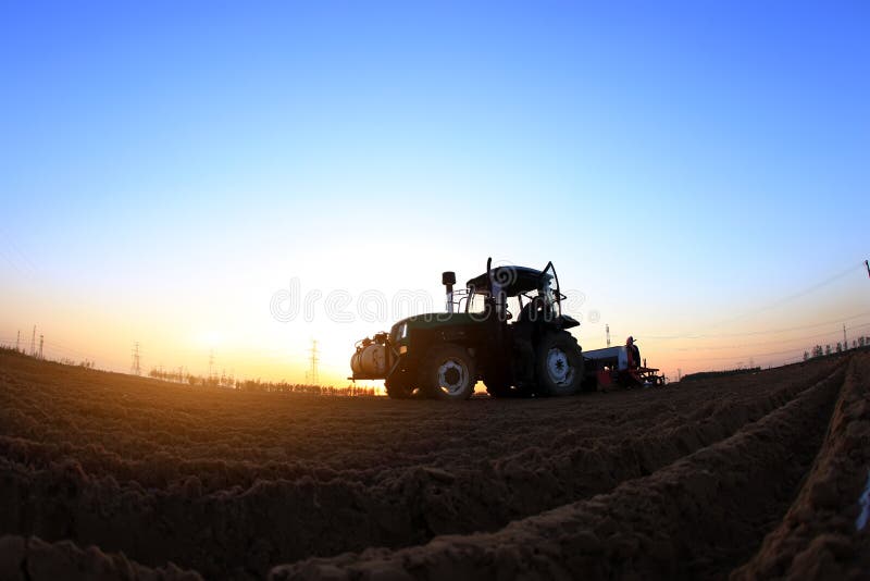 The Tractor in Farmland Farming Stock Photo - Image of equipment ...
