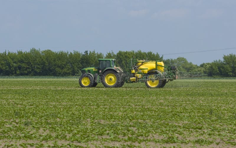 Tractor fertilizing field editorial photography. Image of john - 9464547
