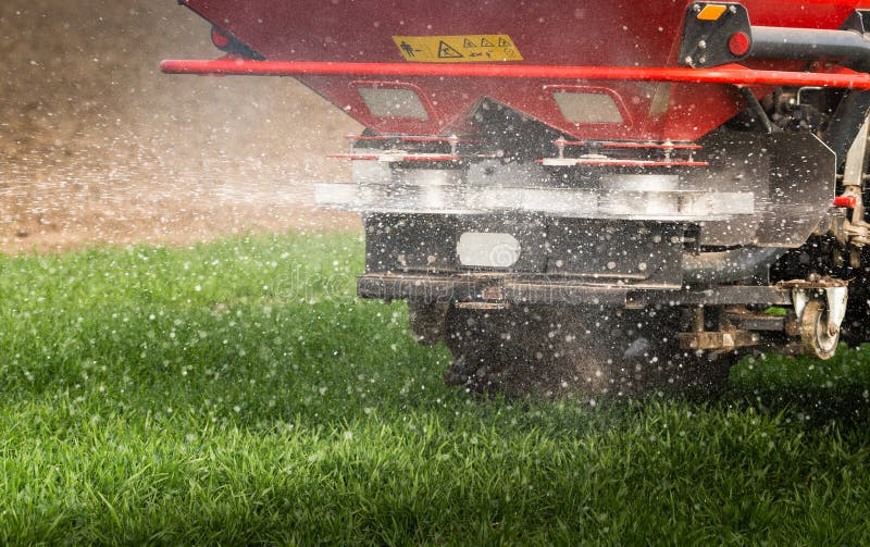 Tractor Fertilizing in Field Stock Photo - Image of space, farmland ...