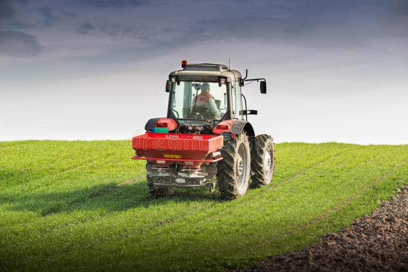 Tractor Fertilizing in Field Stock Image - Image of farm, driving: 68756325